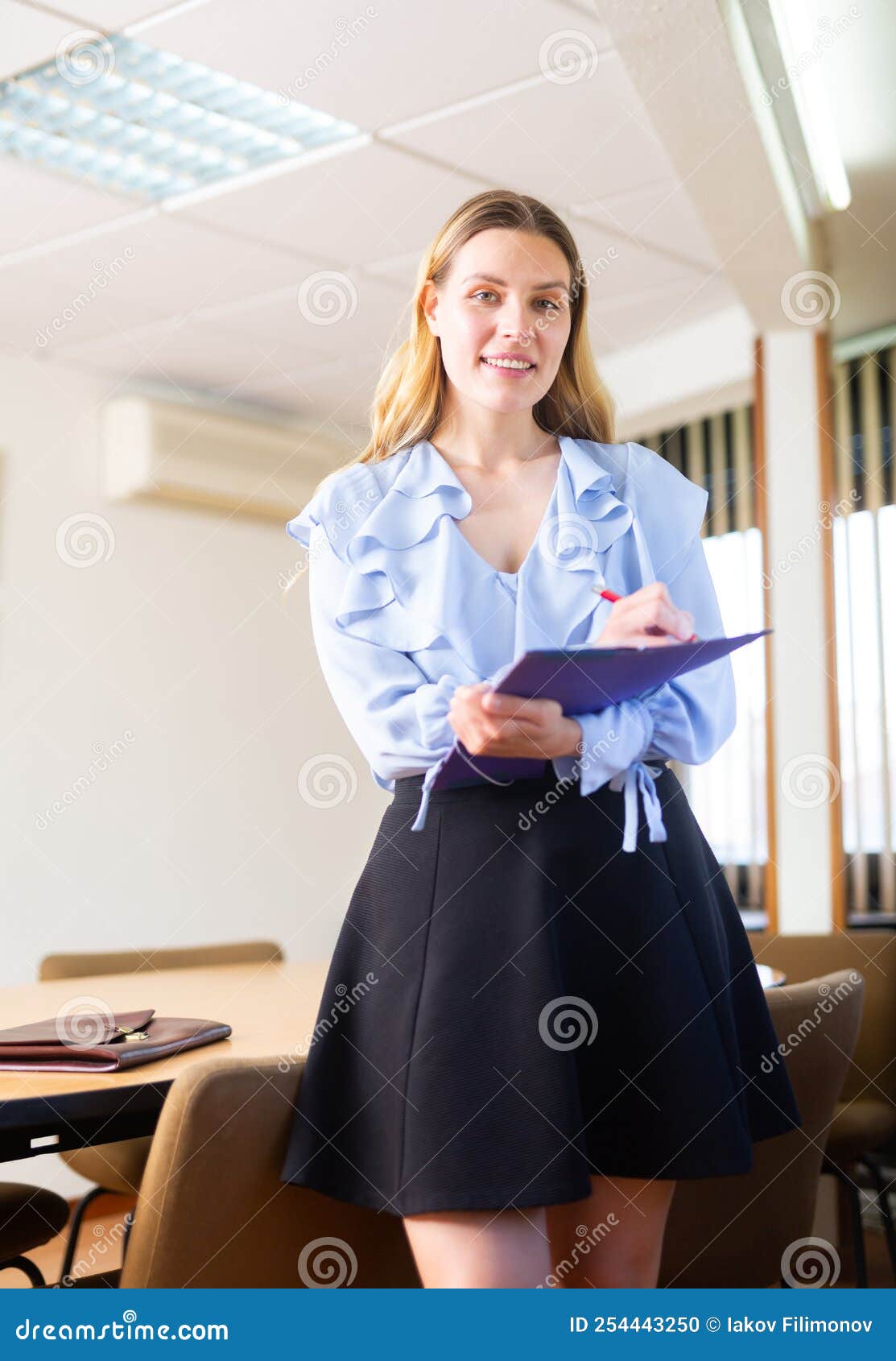 Positive Secretary with Folder for Documents in Office Stock Photo ...