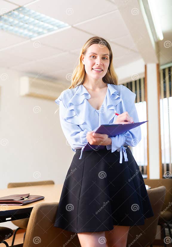 Positive Secretary with Folder for Documents in Office Stock Photo ...