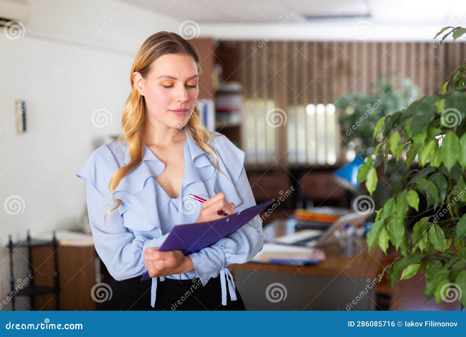 Positive Secretary with Folder for Documents in Office Stock Photo ...