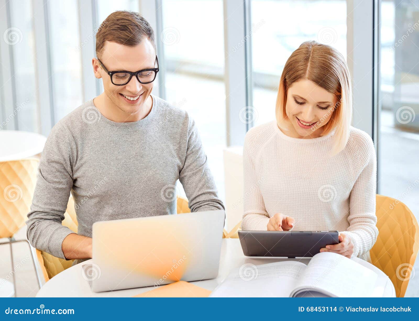 Positive students studying stock photo. Image of chair - 68453114