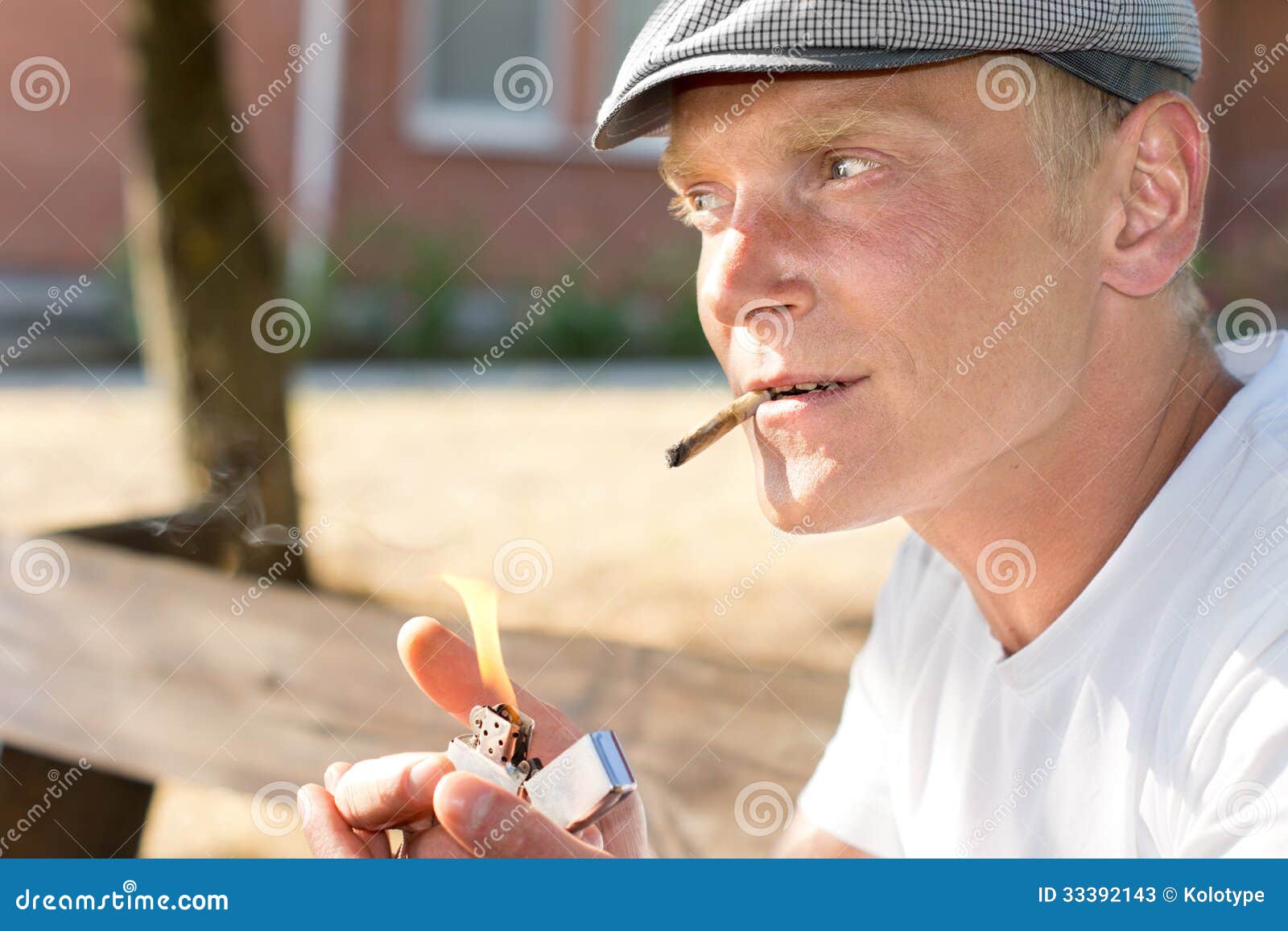 Positive Thoughtful Man Lighting a Brown Cigarette Stock Image - Image ... Positive Thoughtful Man Lighting a Brown Cigarette Stock Image - Image ...