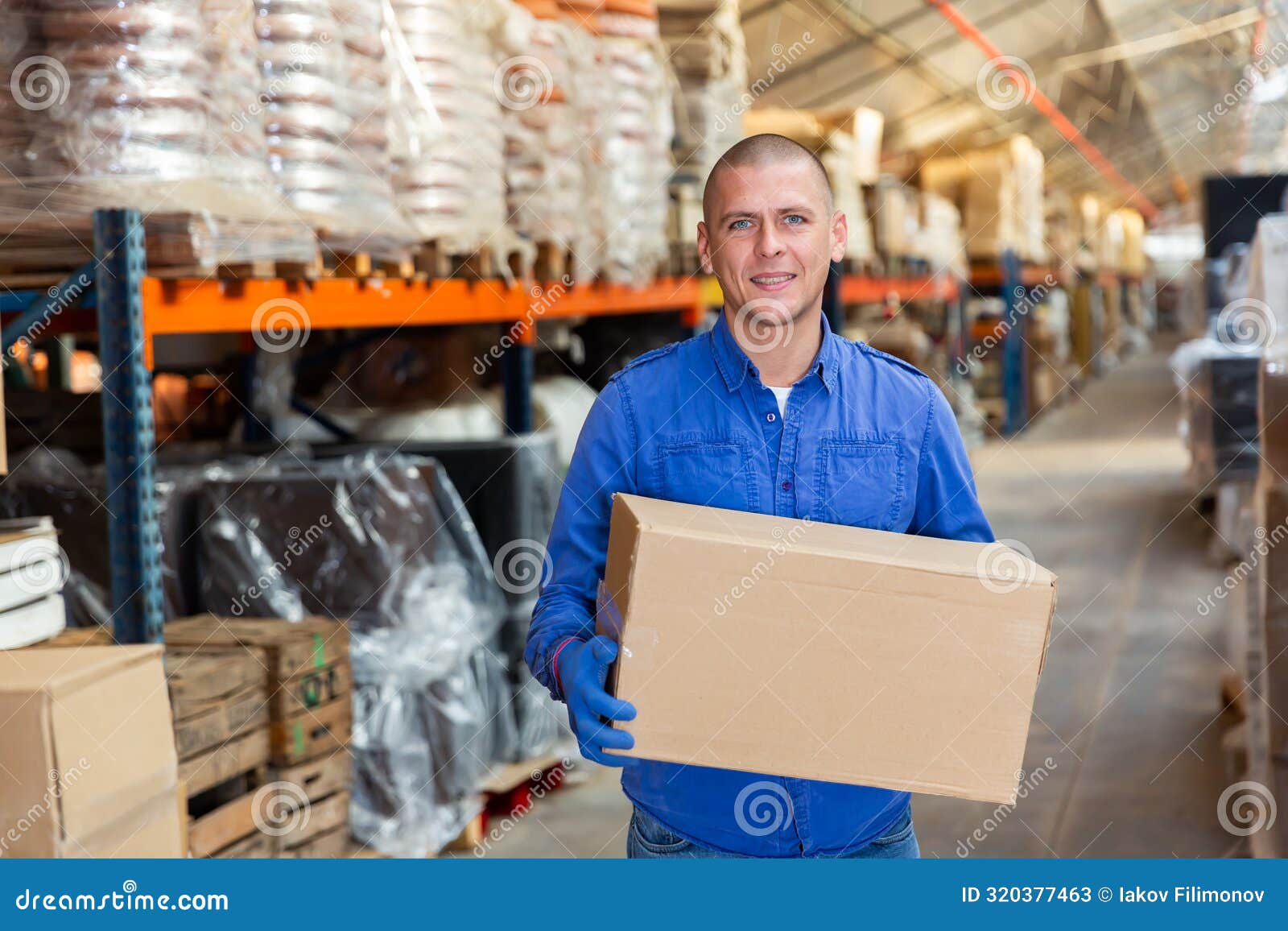 Positive Warehouse Worker Dragging Boxes on Hands Stock Image - Image ...