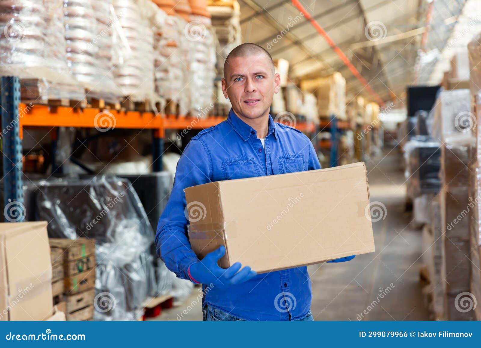 Positive Warehouse Worker Dragging Boxes on Hands Stock Photo - Image ...