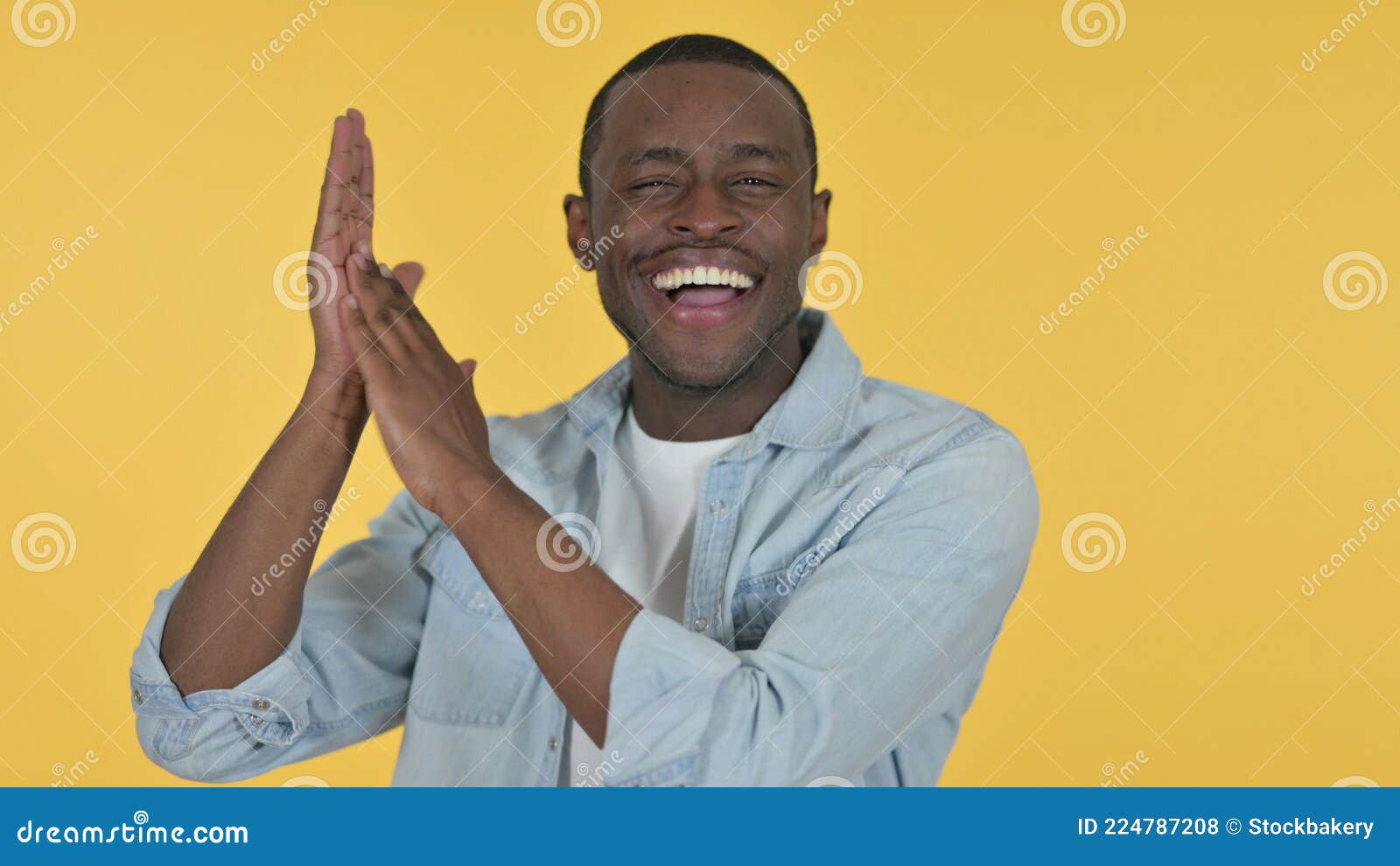 Positive Young African Man Clapping, Yellow Background Stock Photo ...
