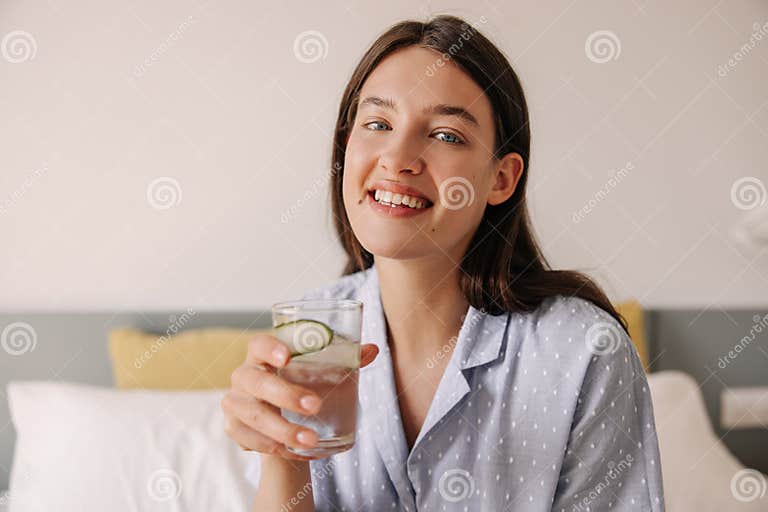Positive Young Caucasian Girl Smiling With Teeth And Looking At Camera