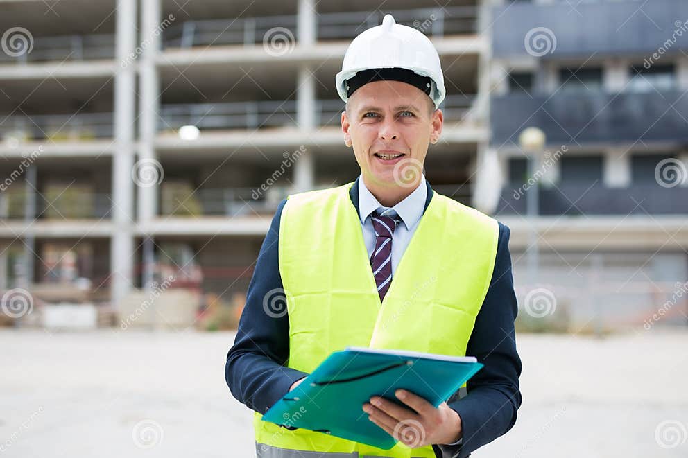 Positive Young Engineer Attentive Studies Work Documents Stock Photo ...