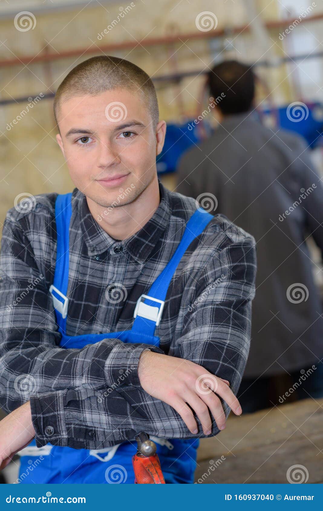 Positive Young Garage Worker Stock Photo - Image of warehouse, people ...