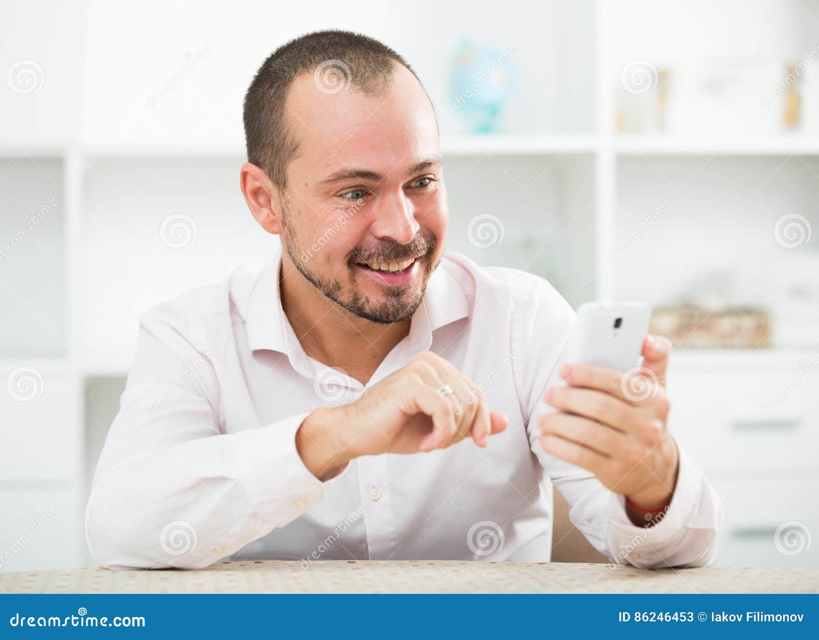 Positive Young Man with Smartphone Stock Image - Image of face, married ...