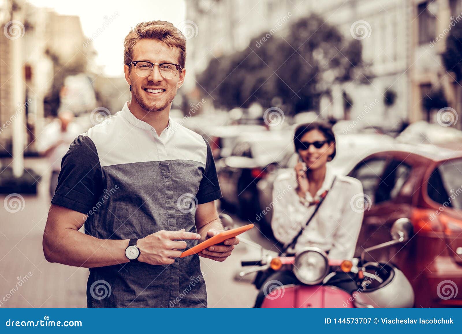Positive Young Man Standing with a Tablet Stock Image - Image of ...