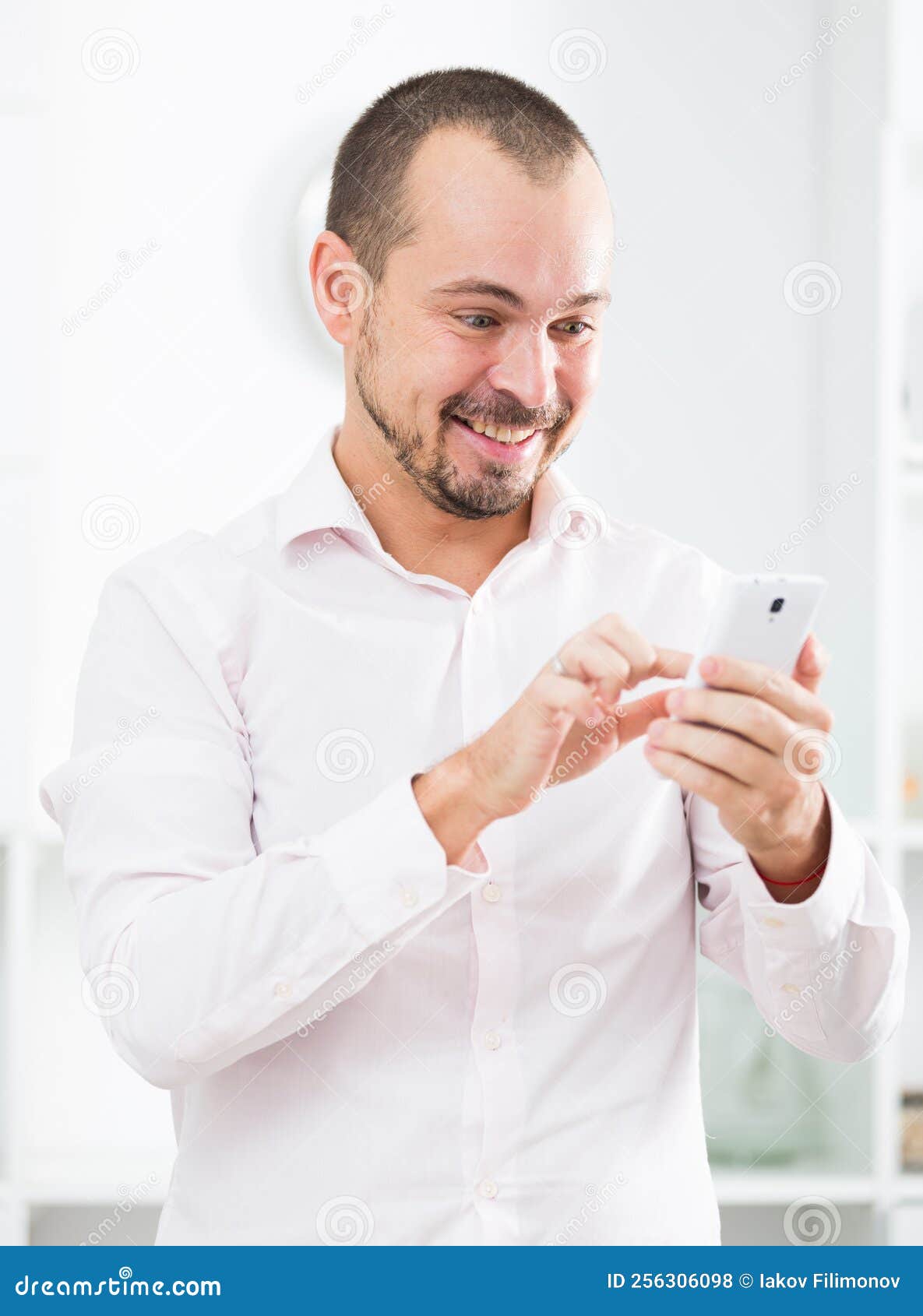 Positive Young Man with Smartphone Stock Photo - Image of camera ...