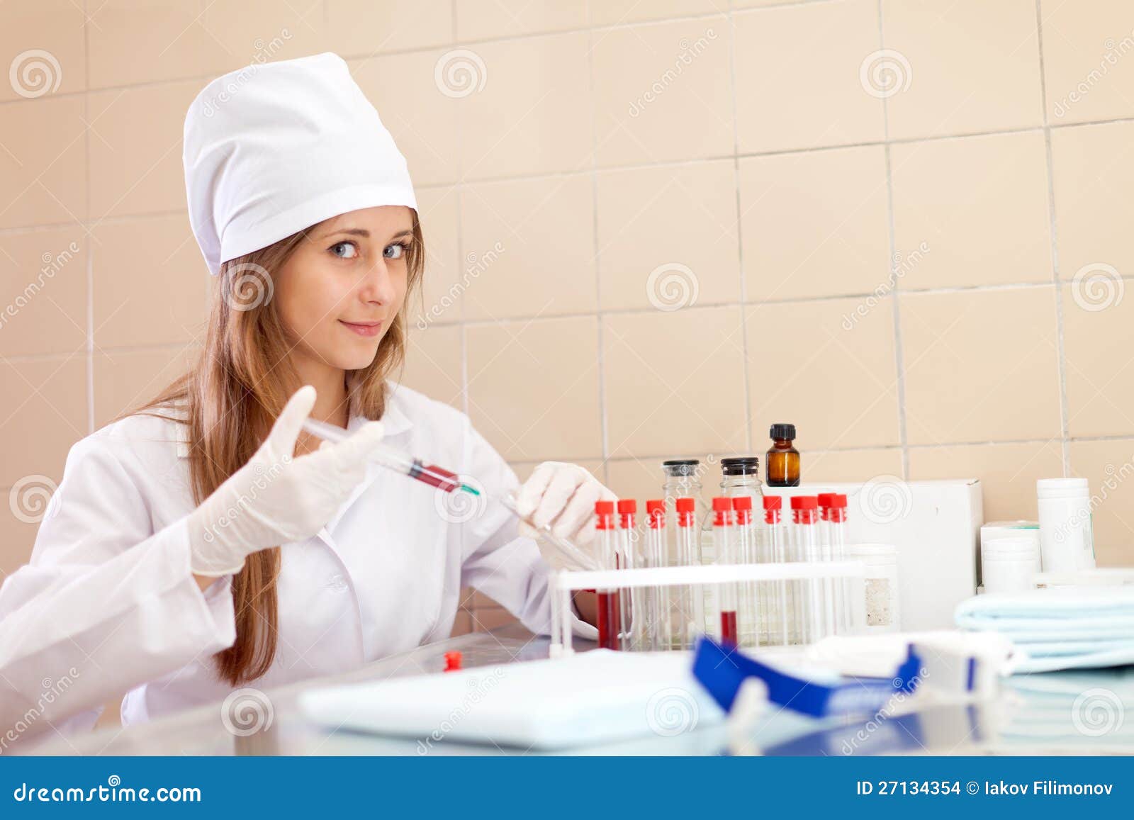 Positive Young Nurse in Laboratory Stock Photo - Image of coat, glass ...