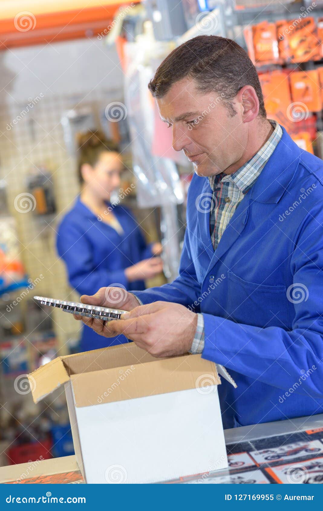 Positive Young Storekeeper at Work in Warehouse Stock Image - Image of ...