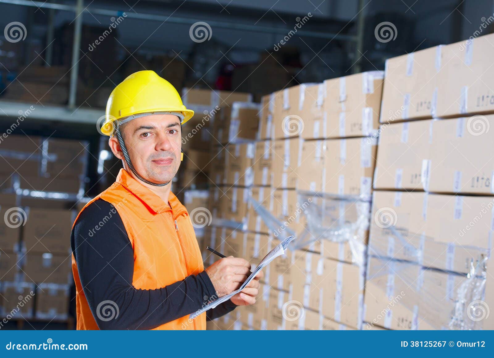 Positive Young Storekeeper at Work in Warehouse Stock Image - Image of ...