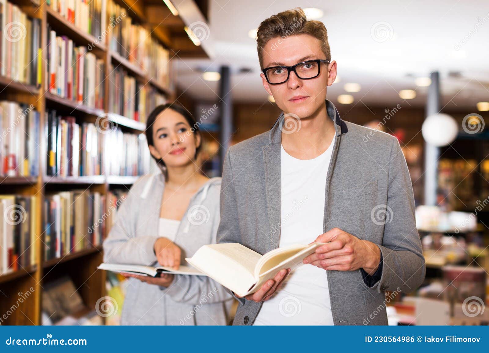 Students Reading and Discussing Books Stock Photo - Image of library ... Students Reading and Discussing Books Stock Photo - Image of library ...