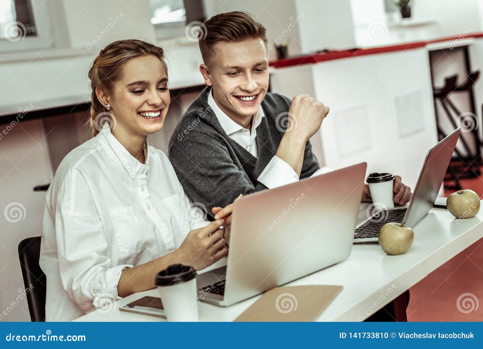 Positive Young Workers Spending Time in Office while Dealing with ...