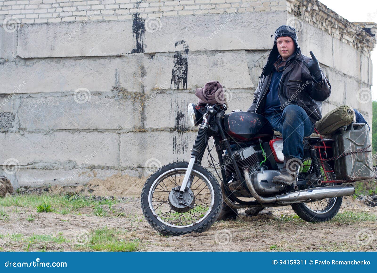 A Post Apocalyptic Man on Motorcycle Near the Destroyed Building Stock ...