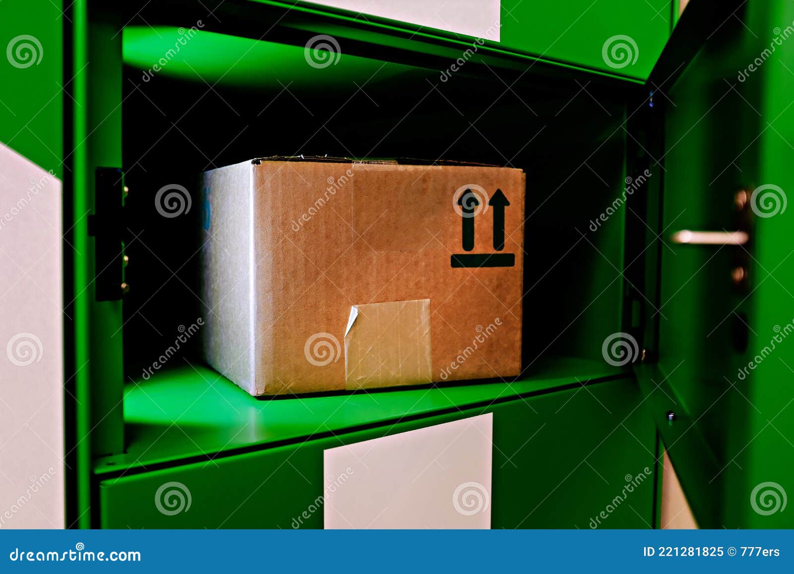 Post Automat Terminal and a Parcel in it. Mail Delivery Packstation ...