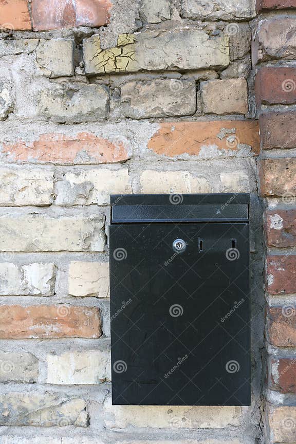 Post box on a brick wall. stock image. Image of construction - 91959871