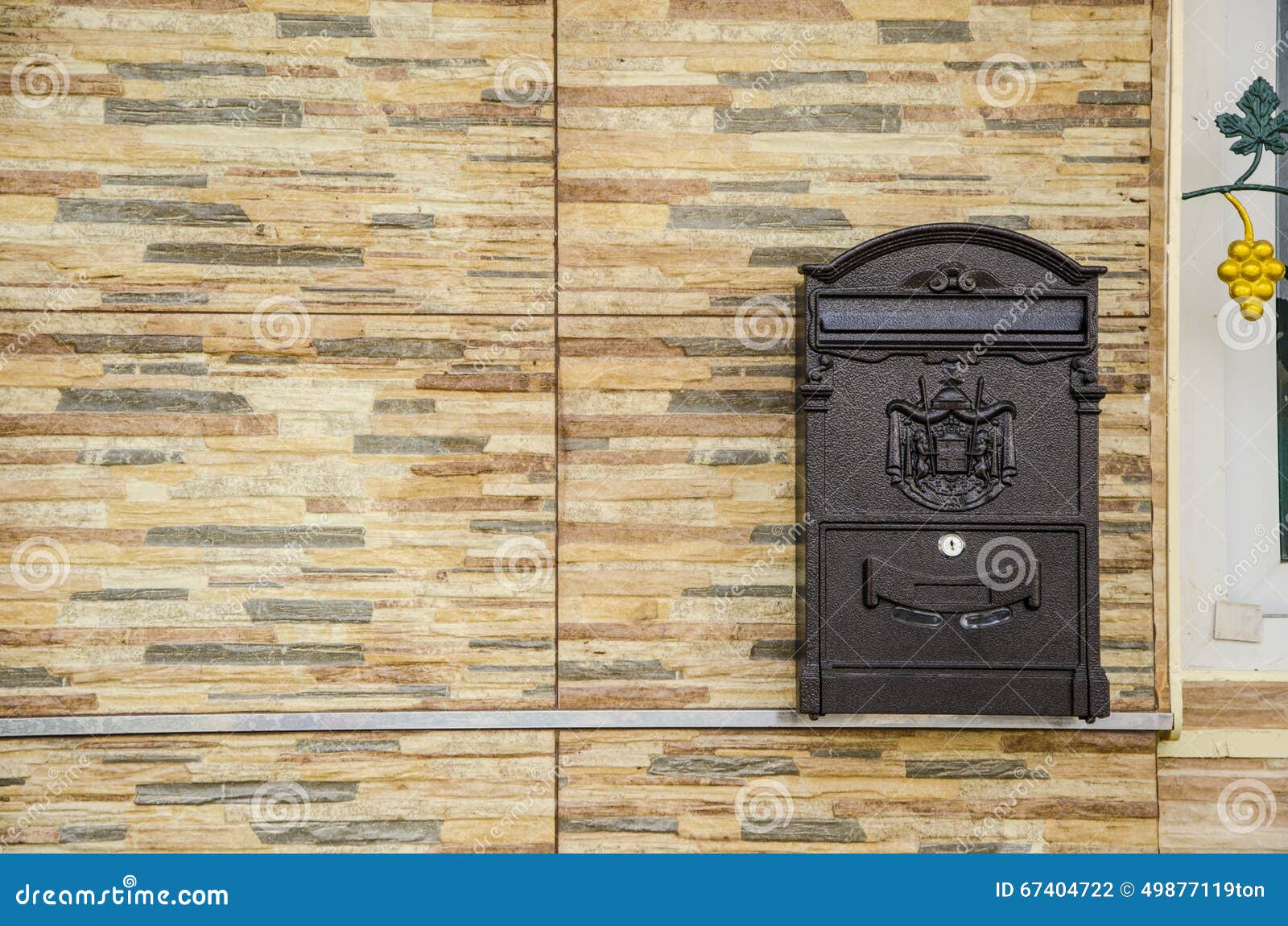 Post box on wall stone stock photo. Image of postbox - 67404722