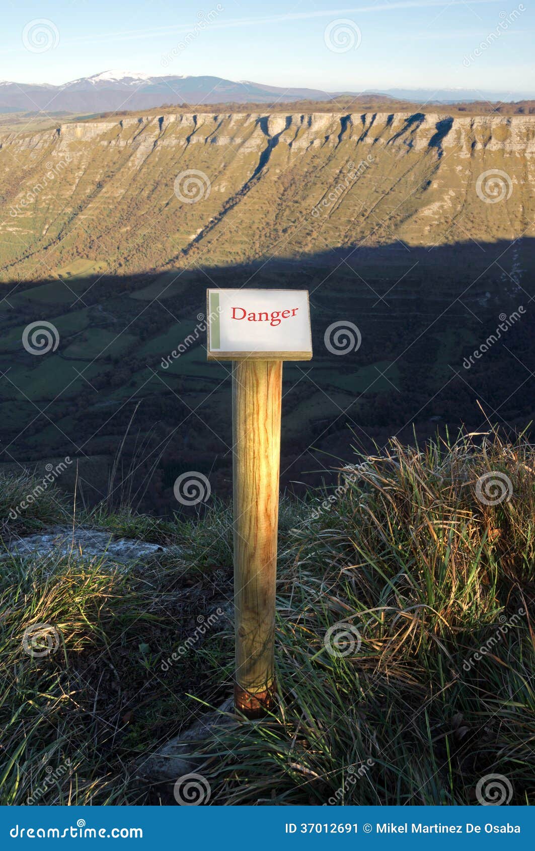 Post with Danger Sign on Mountain Cliff Stock Image - Image of warning ...