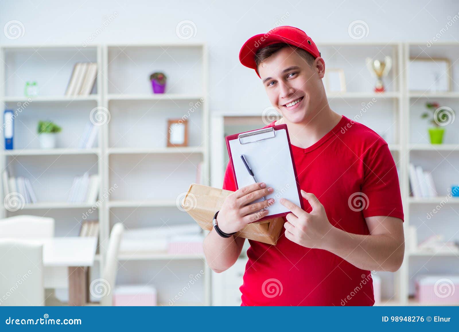 The Post Man Delivering a Parcel Package Stock Photo - Image of ...
