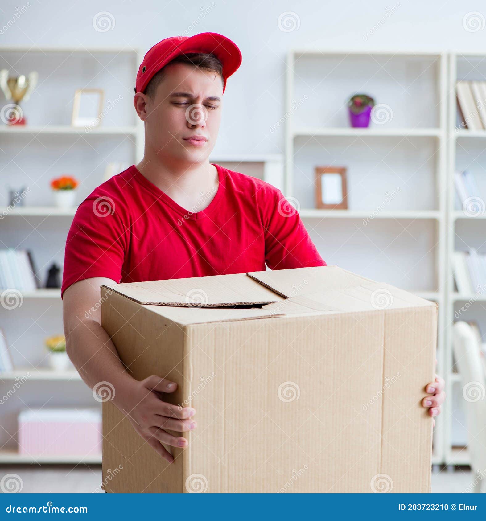 Post Man Delivering a Parcel Package Stock Photo - Image of heavy ...
