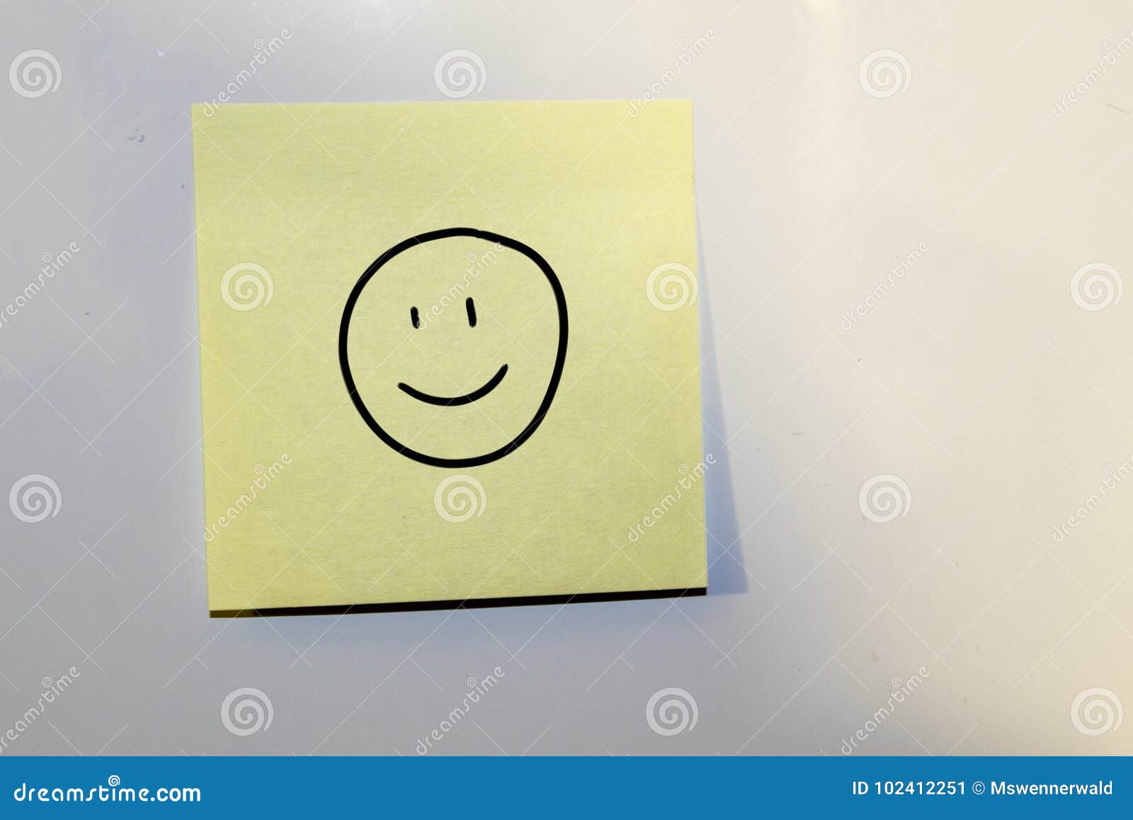 Post-it Note with a Happy Face Drawn Stock Image - Image of postit ...