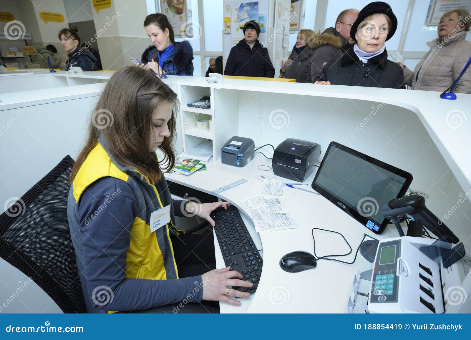 At the Post Office, Reception: Postal Worker Sitting at the Desk Set ...
