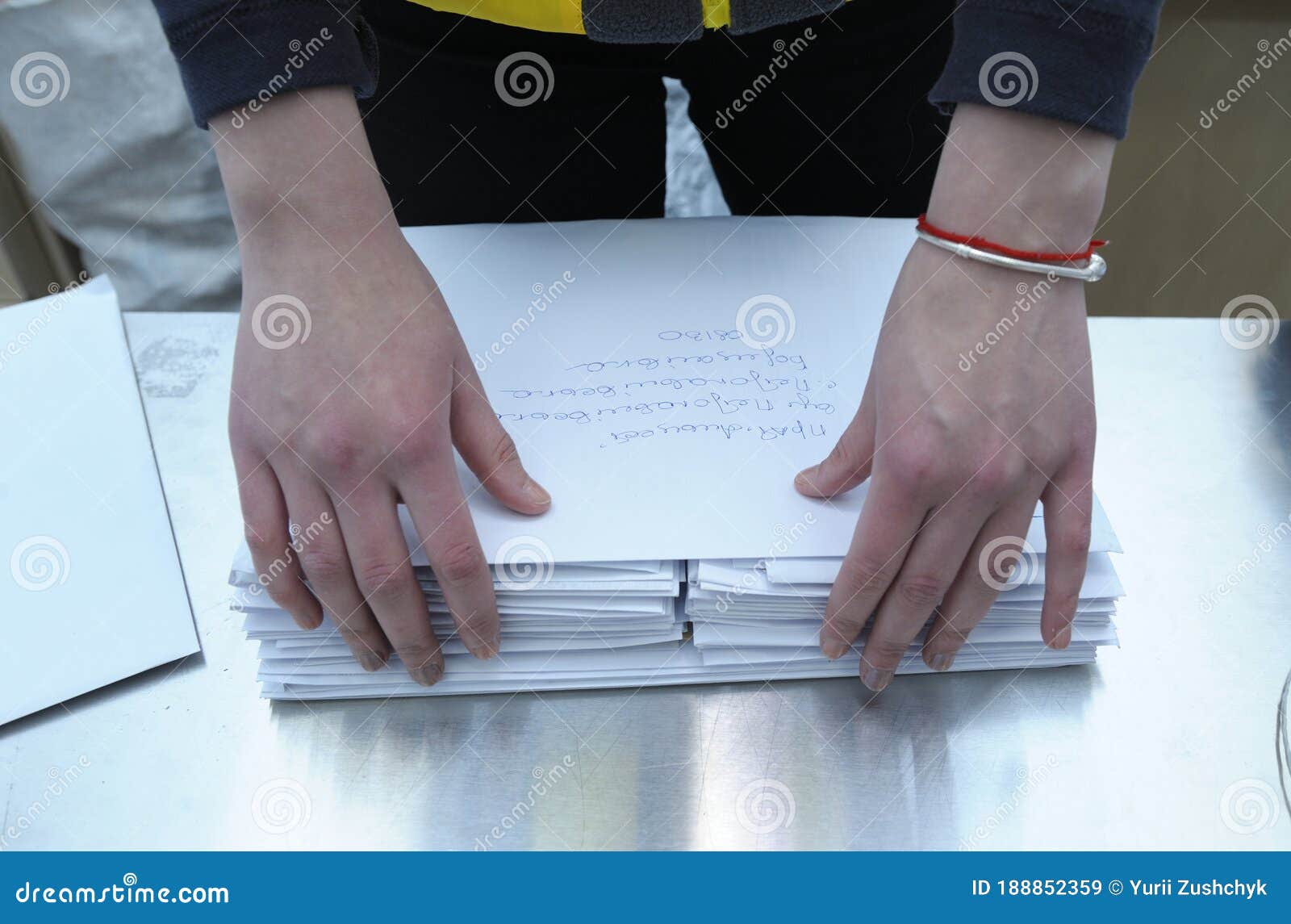 At the Post Office, Sorting Room: Hands of Postal Worker Keeping a Pile ...