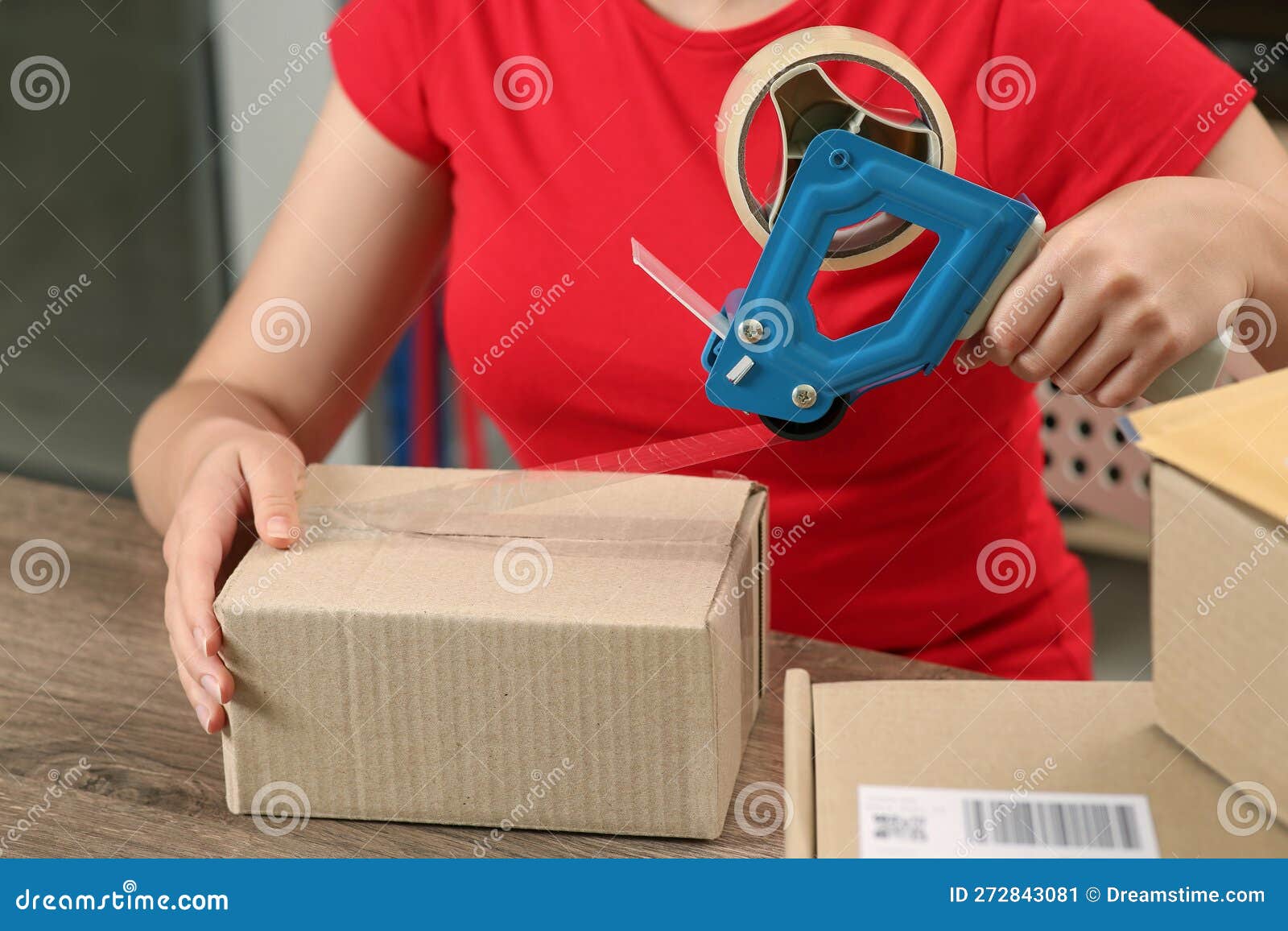 Post Office Worker Packing Parcel at Counter Indoors, Closeup Stock ...