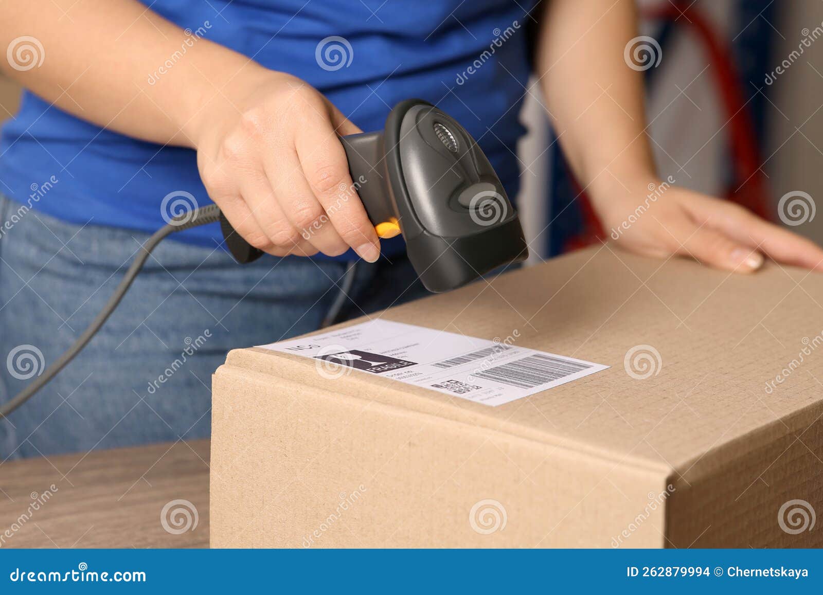 Post Office Worker with Scanner Reading Parcel Barcode at Counter ...
