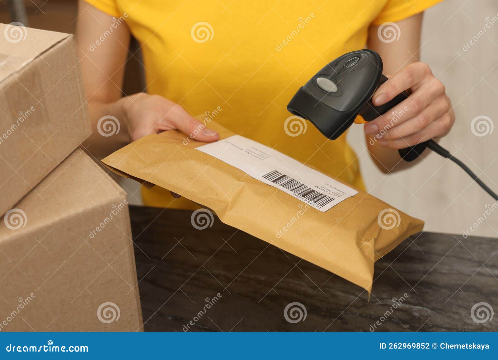 Post Office Worker with Scanner Reading Parcel Barcode at Counter ...