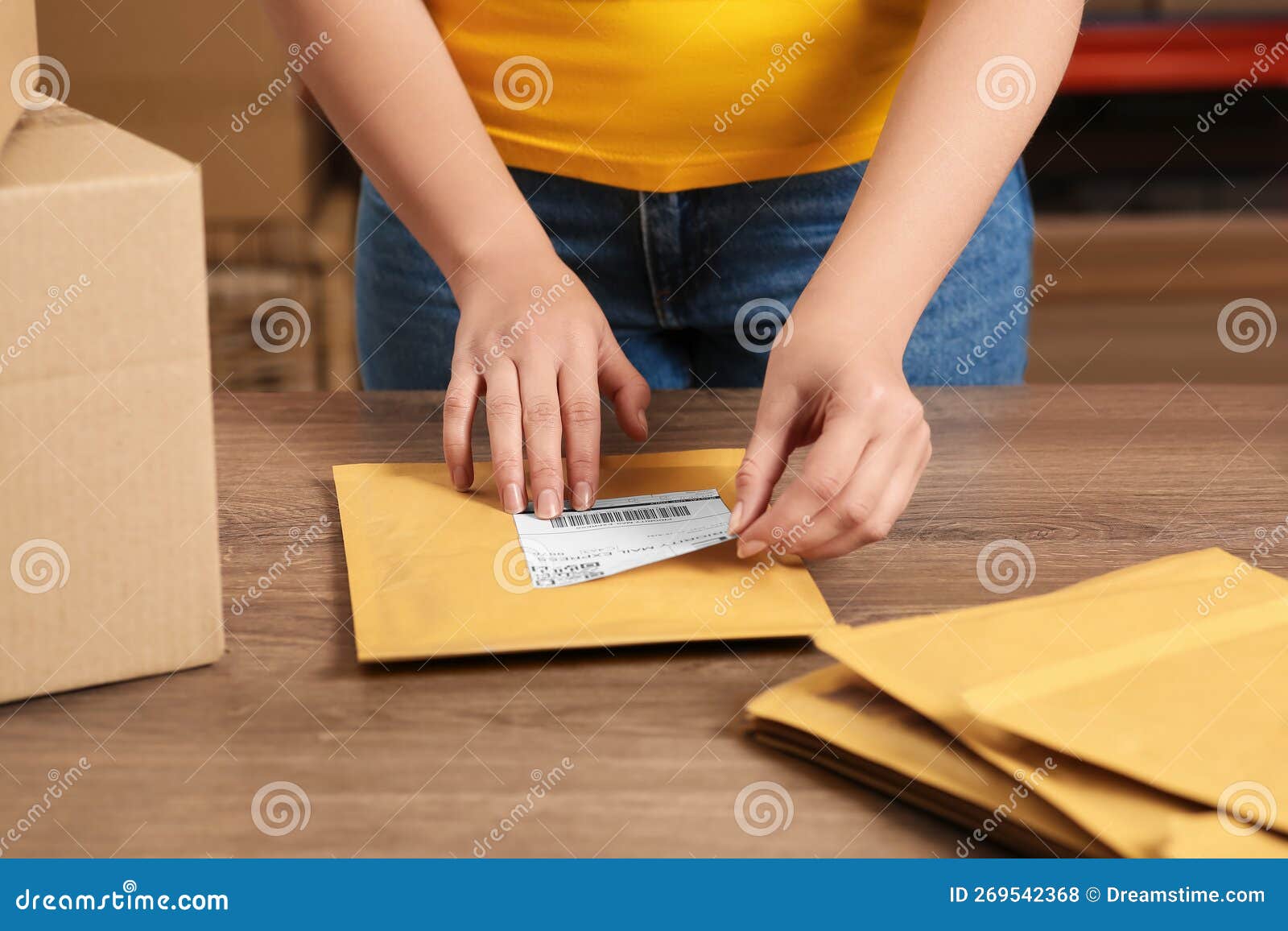 Post Office Worker Sticking Barcode on Parcel at Counter Indoors ...