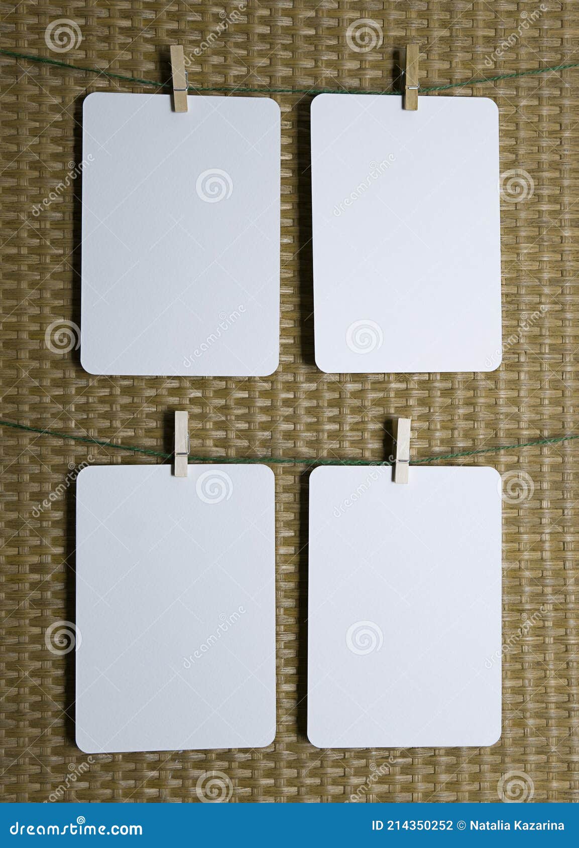 4 Postcards Hang on a String in Two Rows, Copy Space. Blank for Mockup ...