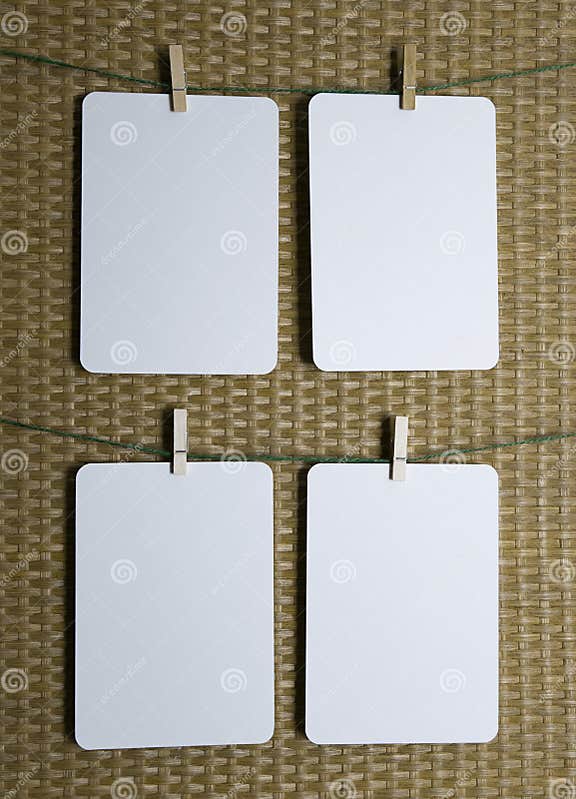 4 Postcards Hang on a String in Two Rows, Copy Space. Blank for Mockup ...