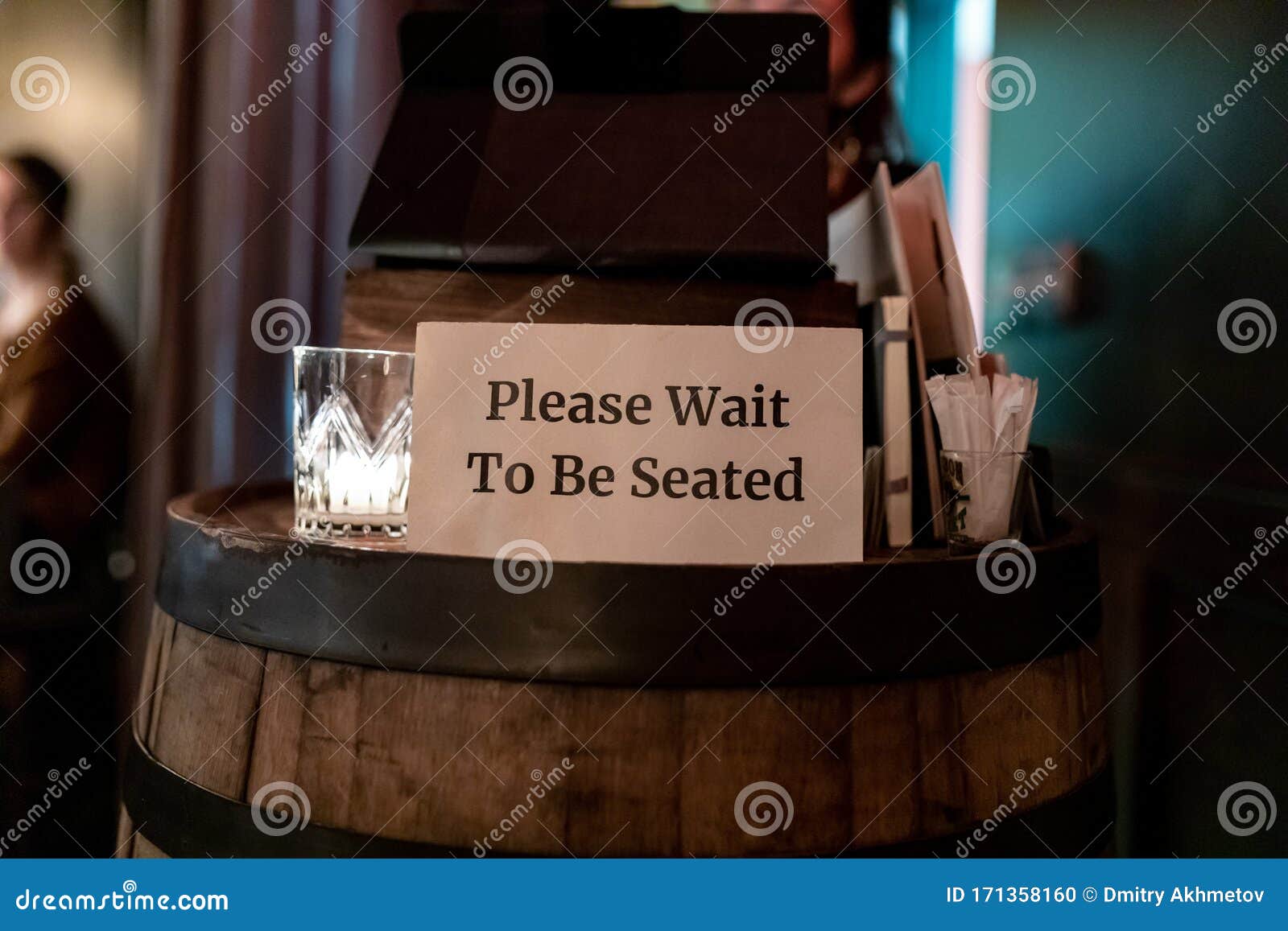 Posted Sign on a Hostess Stand Read `Please Wait To Be Seated` Stock ...