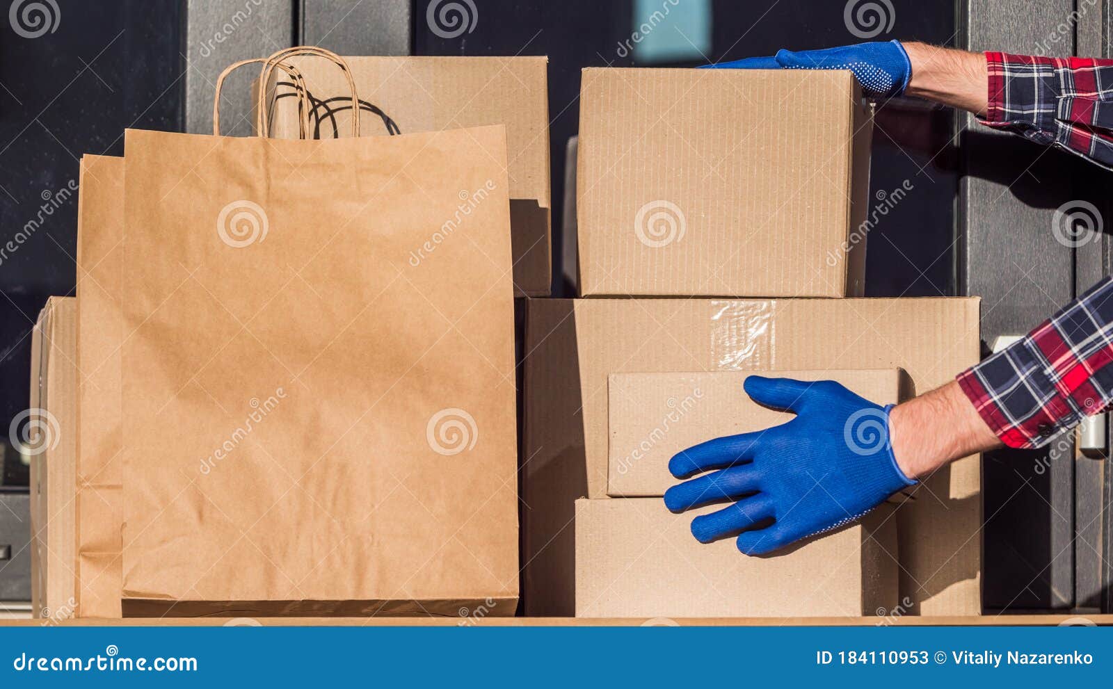 The Postman Brought Several Boxes of Parcels To the Doorstep of the ...