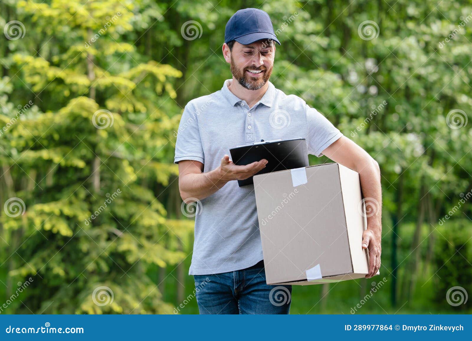 Postman Carrying Package and Documents Outdoors. Stock Photo - Image of ...