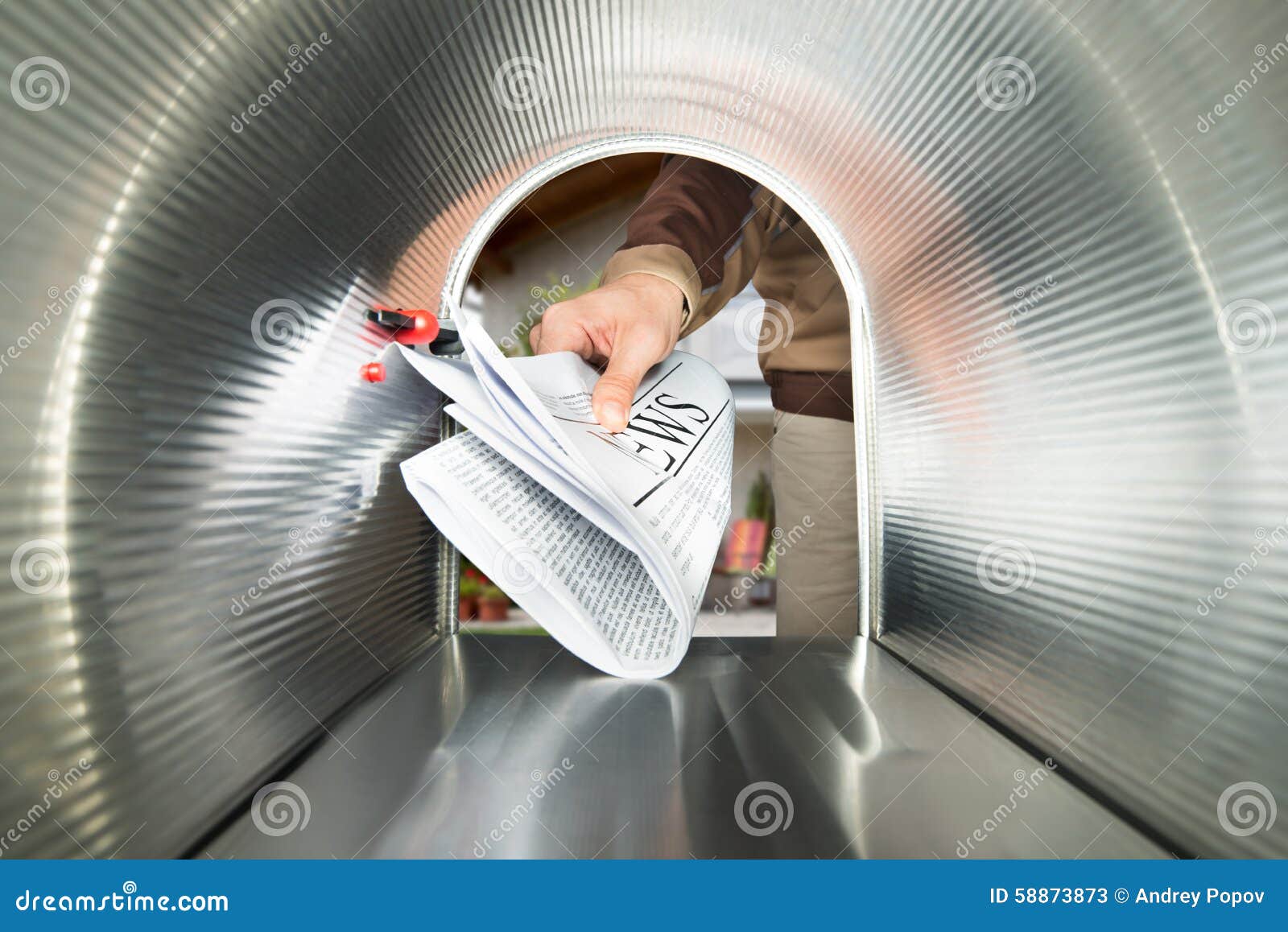 Postman Delivering Newspaper View from Inside the Mailbox Stock Image ...