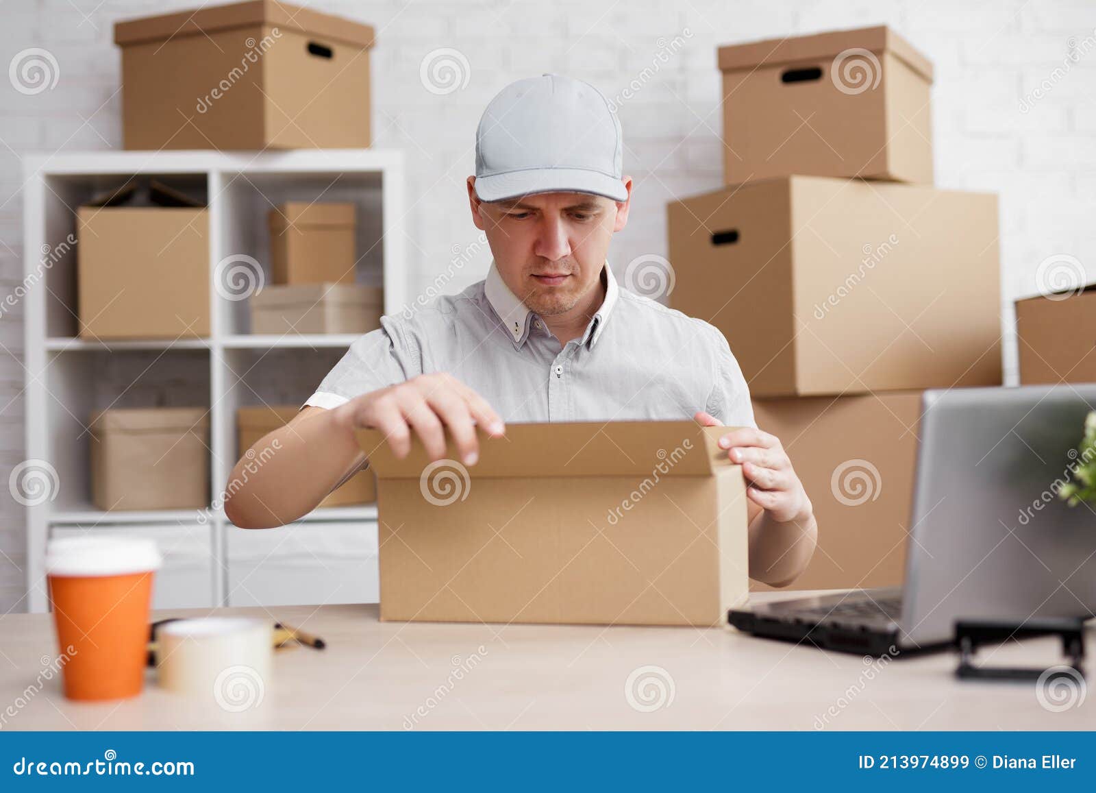Postman Opening or Packing Parcel in Post Office Stock Image - Image of ...