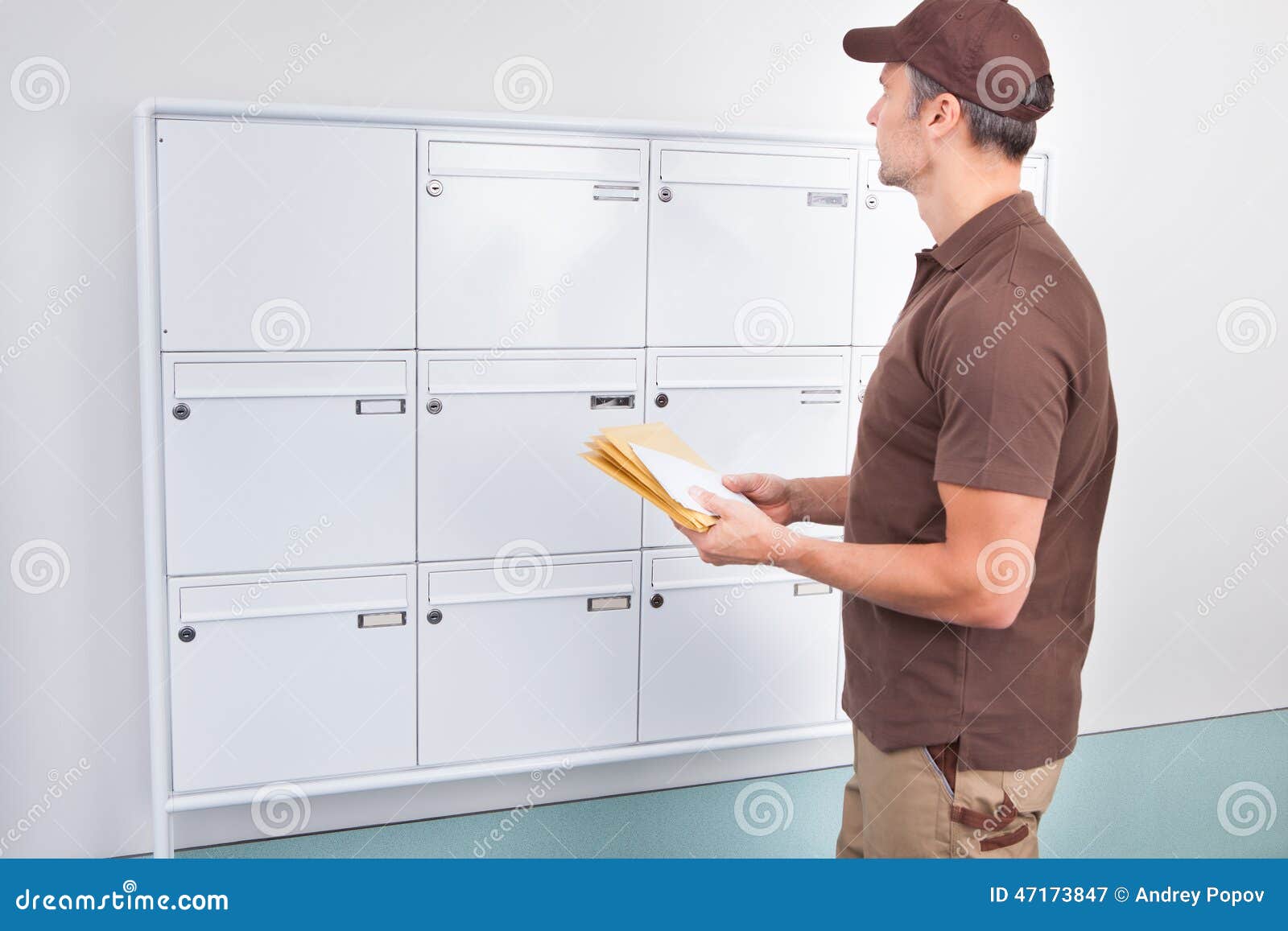 Postman Putting Letters in Mailbox Stock Image - Image of deliver ...