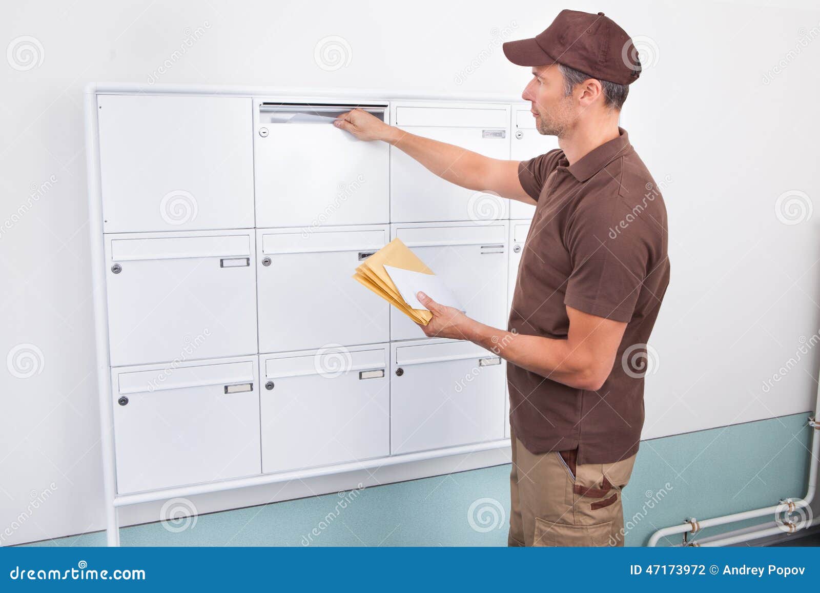 Postman Putting Letters in Mailbox Stock Photo - Image of postal ...