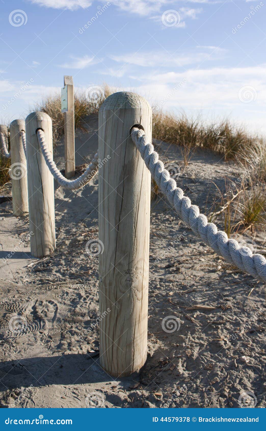 Posts by the beach stock photo. Image of rope, sand, blue - 44579378