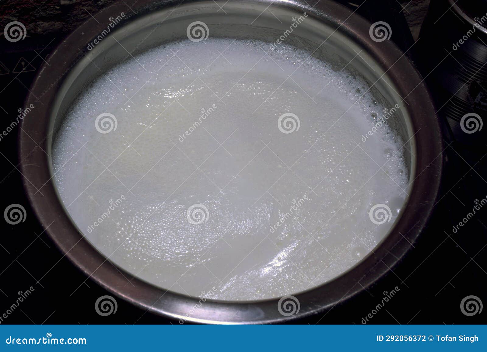 Pot Boiling Fresh Milk for Consumption, Boiling Milk at Induction Store ...