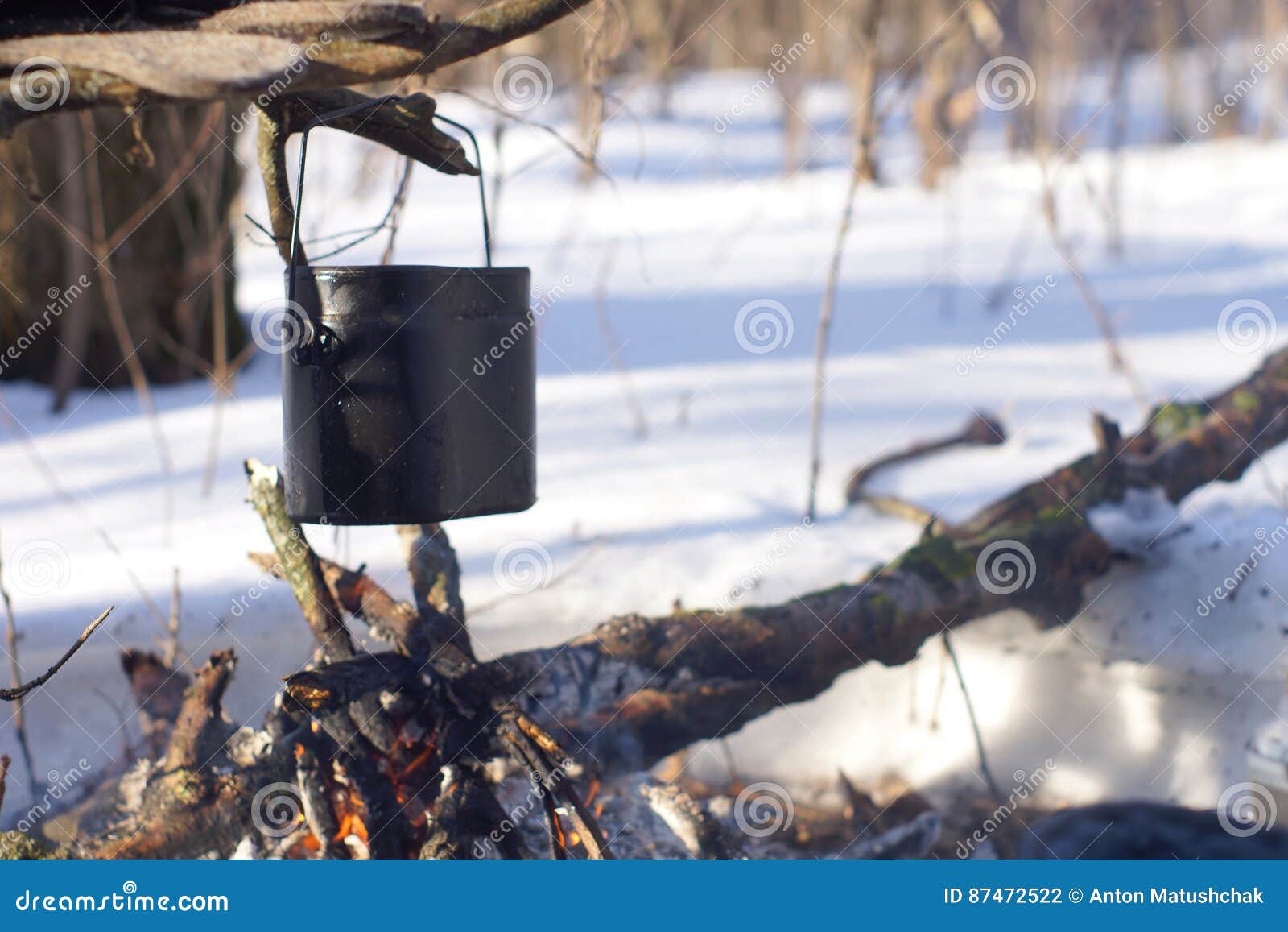 A Pot of Boiling Water on the Fire Warms in the Winter Forest, Stock ...