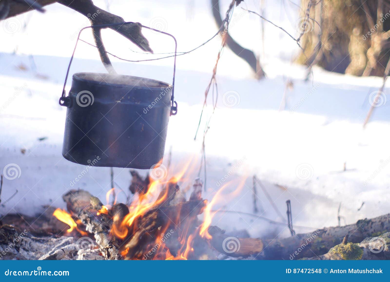 A Pot of Boiling Water on the Fire Warms in the Winter Forest, Stock ...