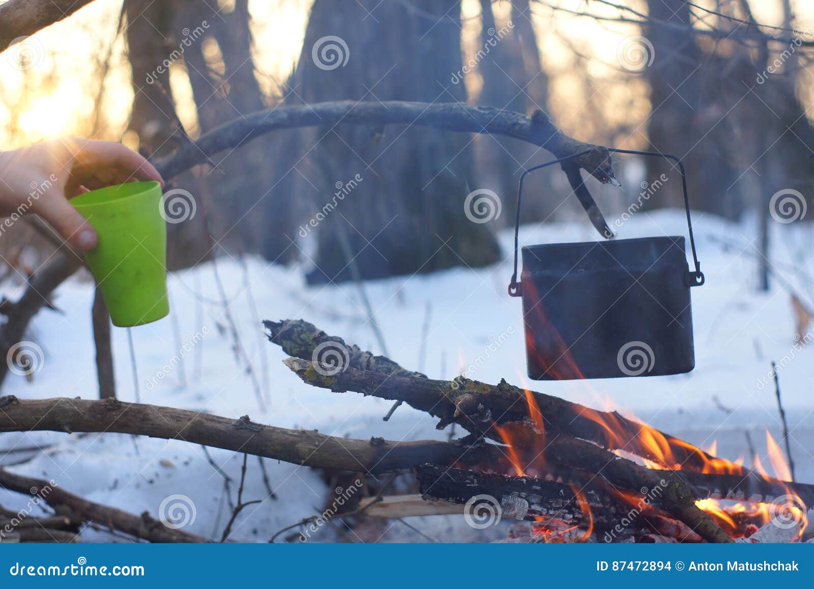 A Pot of Boiling Water on the Fire Warms in the Winter Forest, Stock ...