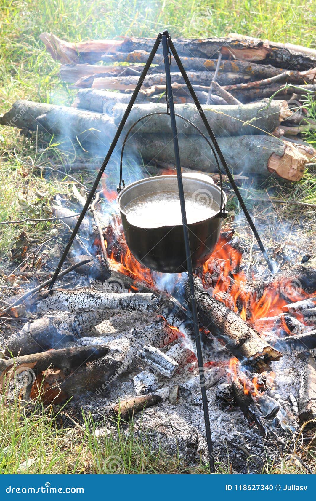 Pot for cooking on a fire stock photo. Image of adventure - 118627340