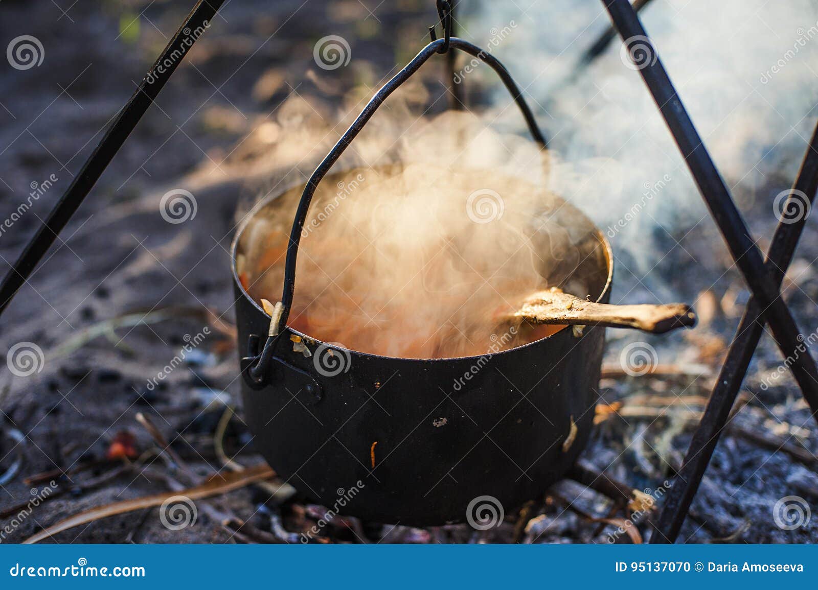 A pot of food at the stake stock photo. Image of forest - 95137070
