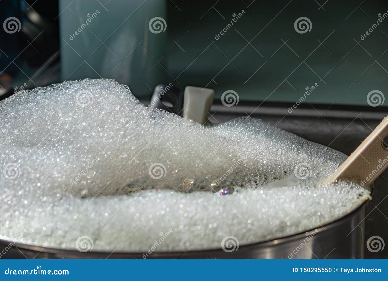 Pot Full of Soapy Water and Bubbles with Kitchen Tools Stock Photo ...
